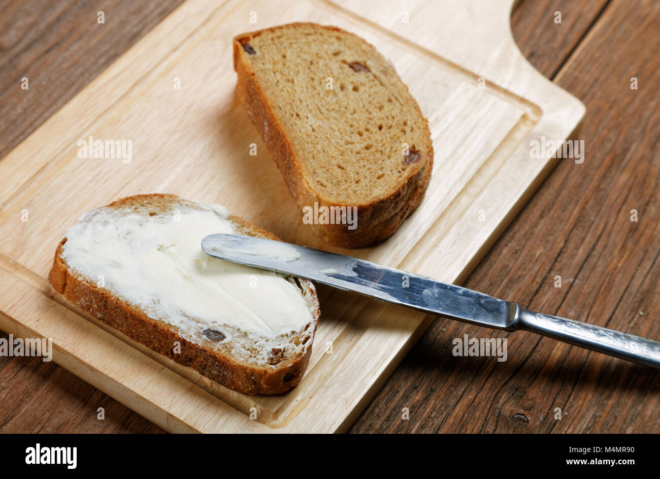 Sliced bread smeared with butter close-up Stock Photo - Alamy