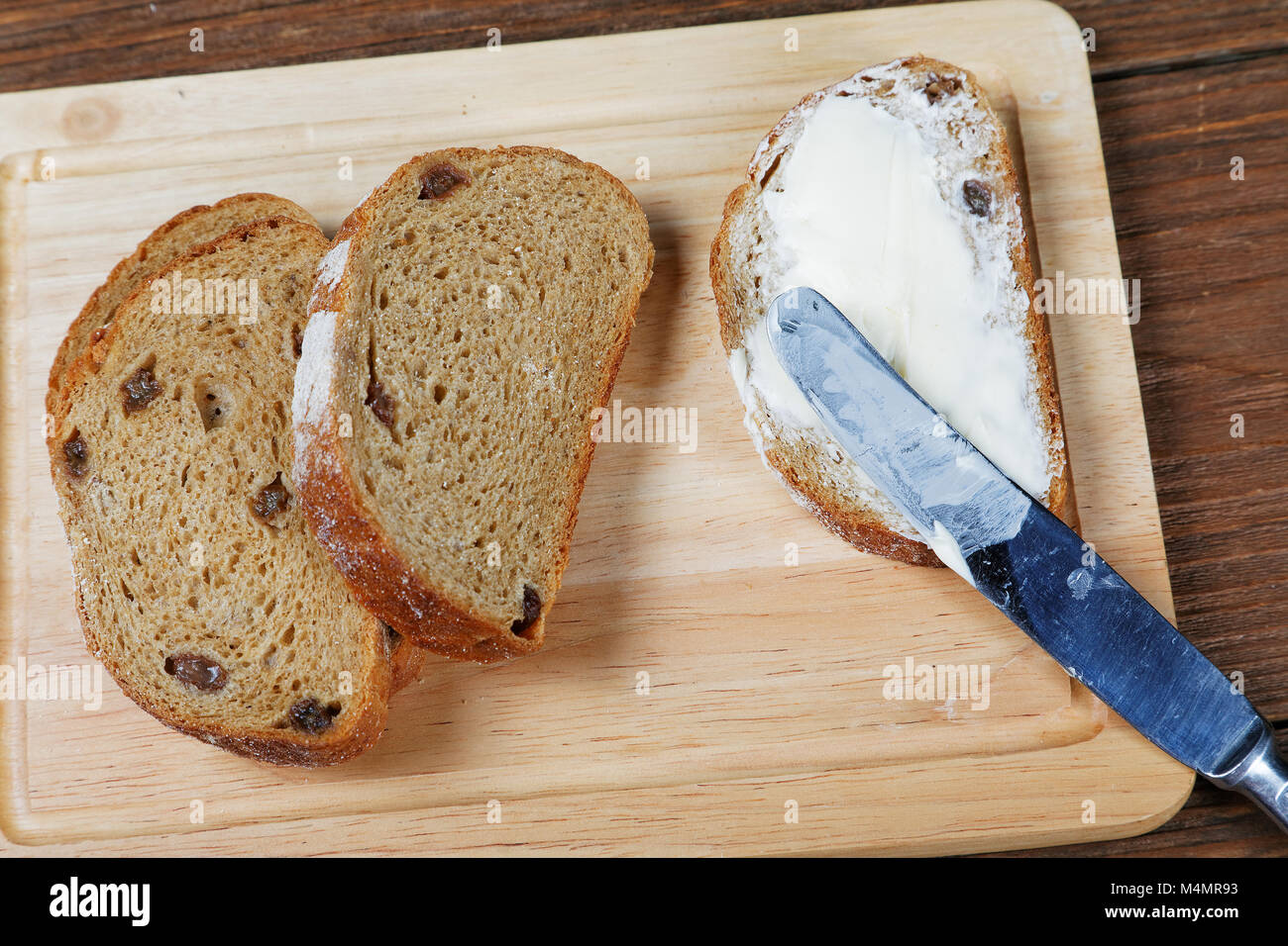Sliced bread smeared with butter close-up Stock Photo - Alamy