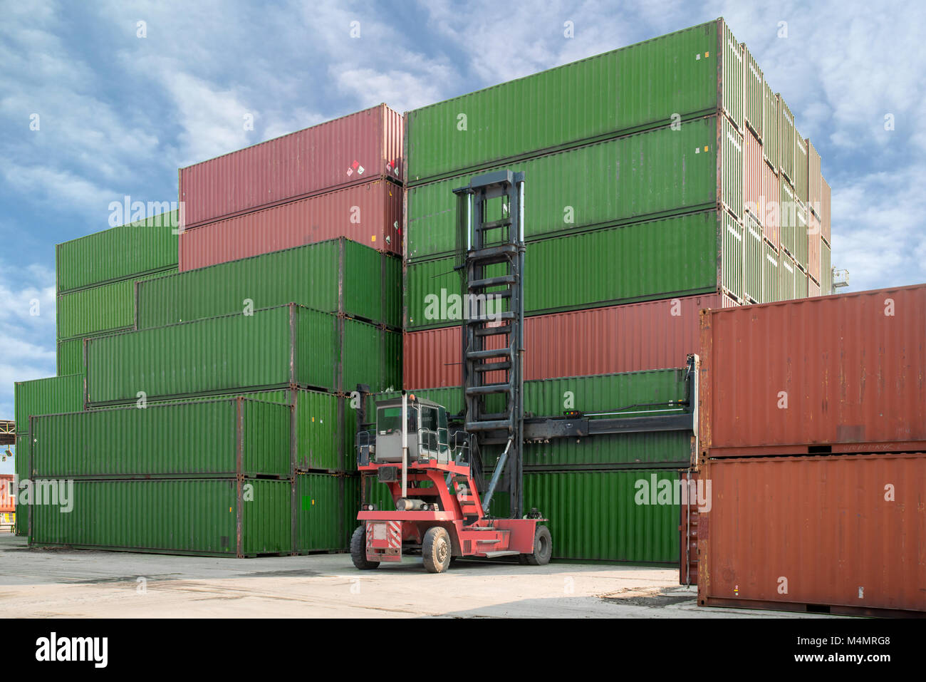 Forklift lifting container box loading to container depot use for cargo ...