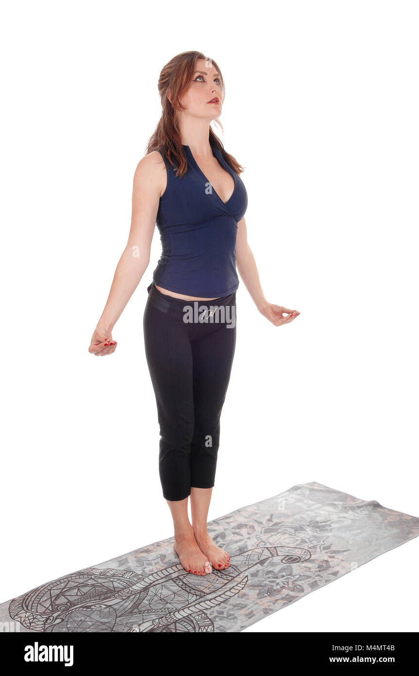 Doing standing yoga hi-res stock photography and images - Alamy