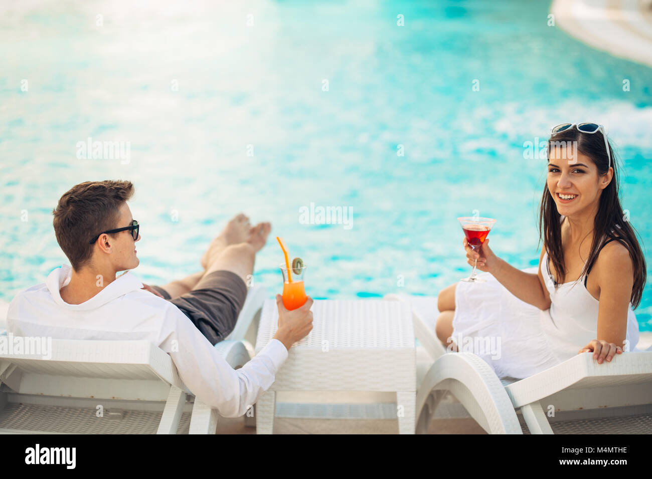 Couple pool resort hi-res stock photography and images - Alamy