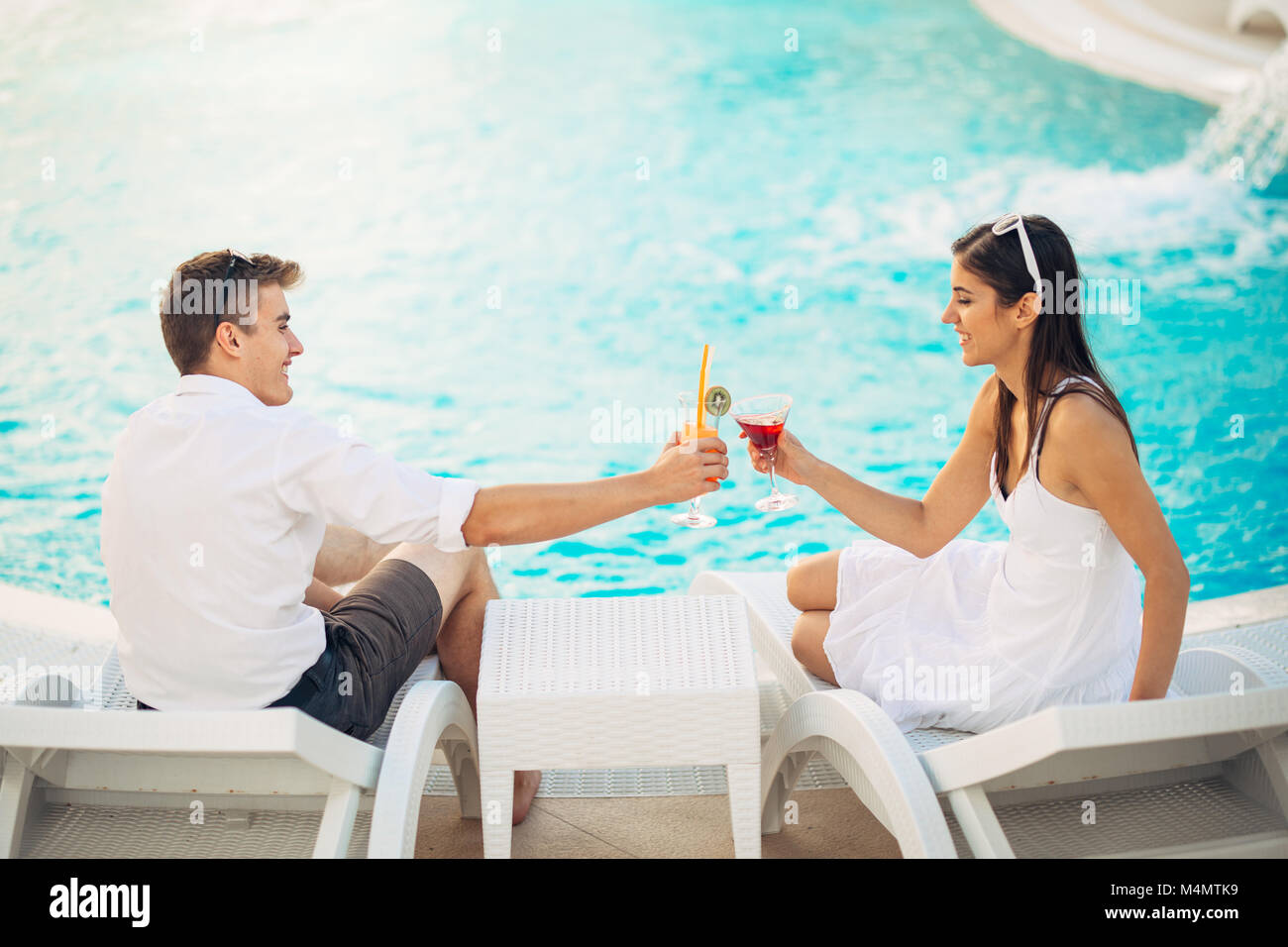 Honeymoon couple in a swimming pool hi-res stock photography and images ...