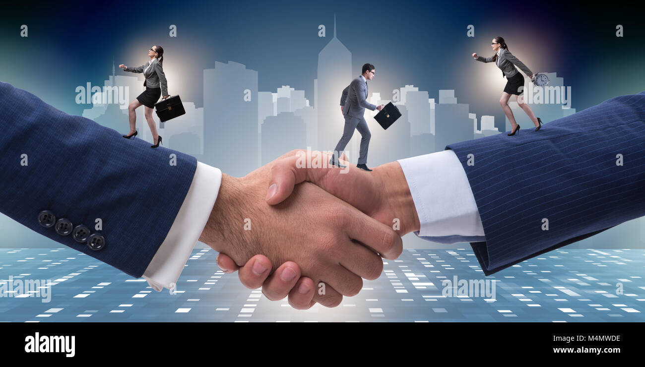 Cooperation concept with people running on handshake Stock Photo - Alamy
