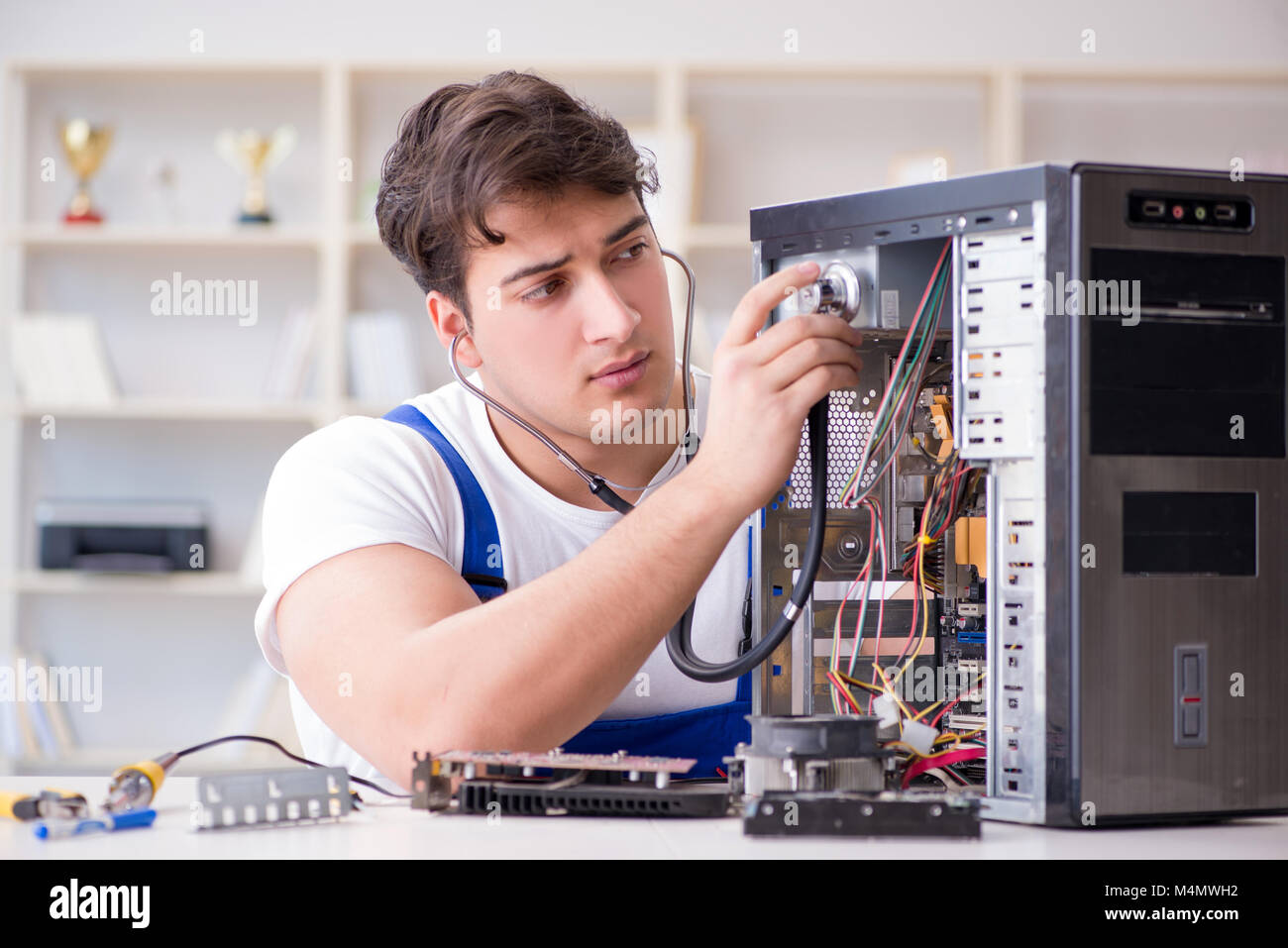 Computer repairman repairing desktop computer Stock Photo - Alamy