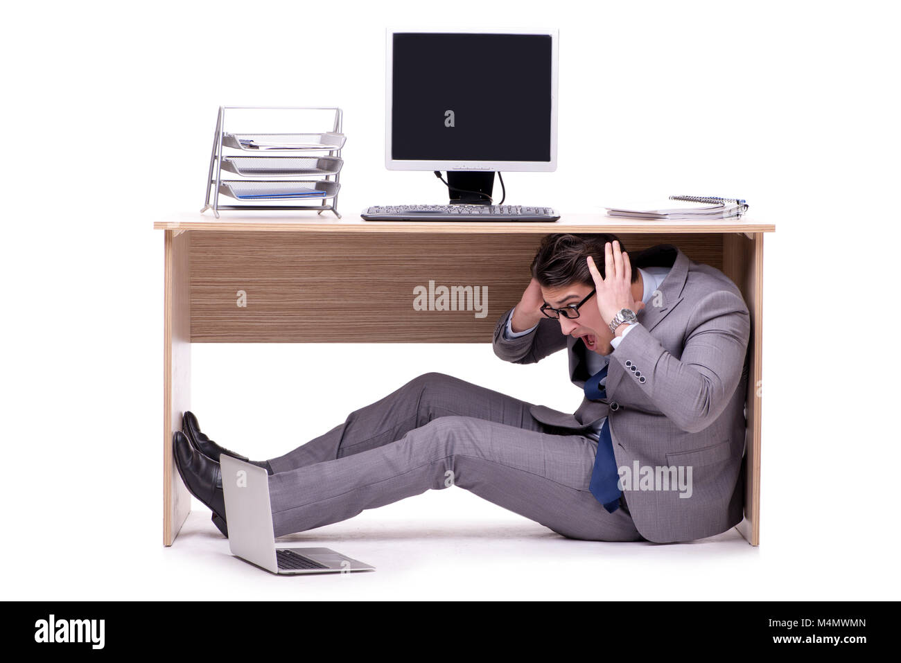 Businessman hiding in the ofice Stock Photo - Alamy