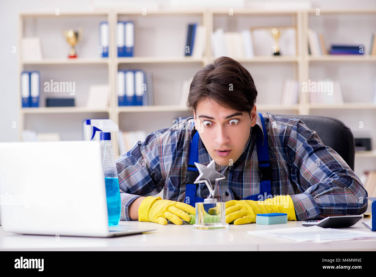 Male cleaner working in the office Stock Photo - Alamy