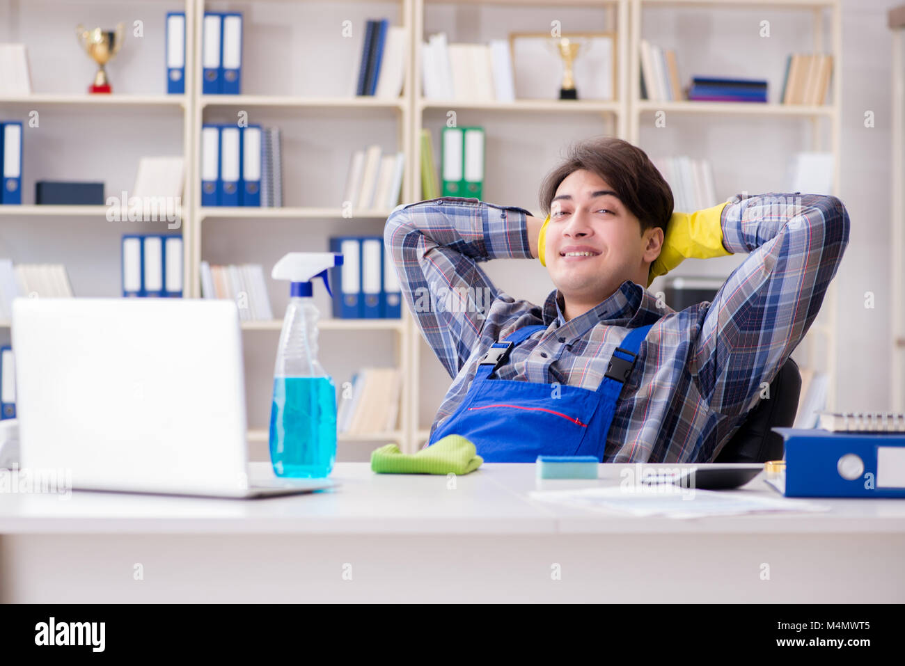 Male cleaner working in the office Stock Photo - Alamy