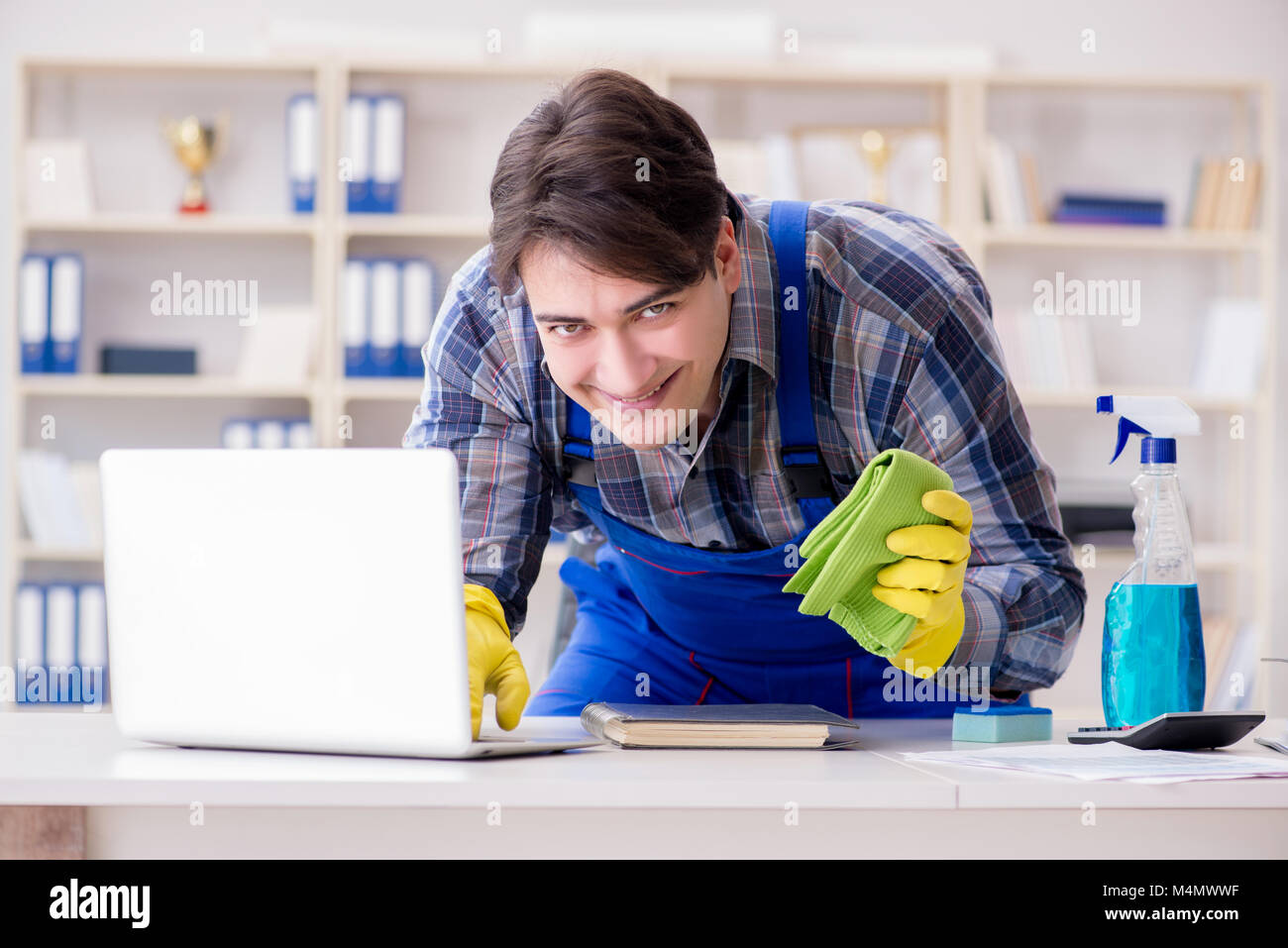 Hacker under cleaner cover stealing personal data Stock Photo - Alamy