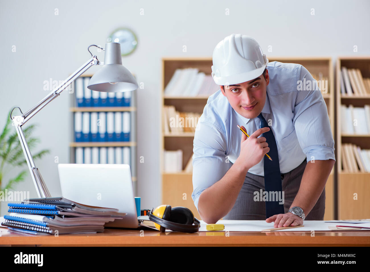 Engineer supervisor working on drawings in the office Stock Photo - Alamy