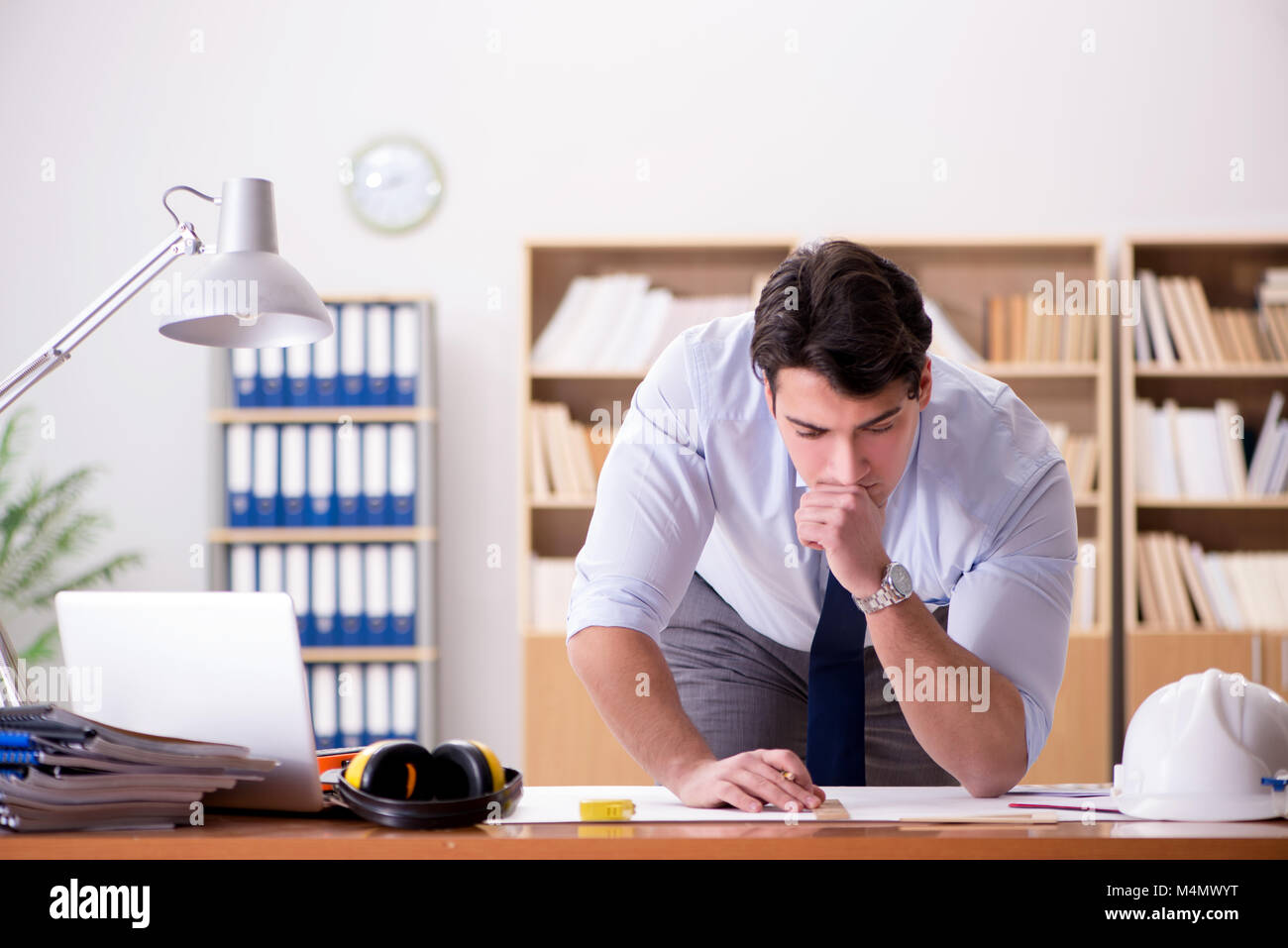 Engineer supervisor working on drawings in the office Stock Photo - Alamy