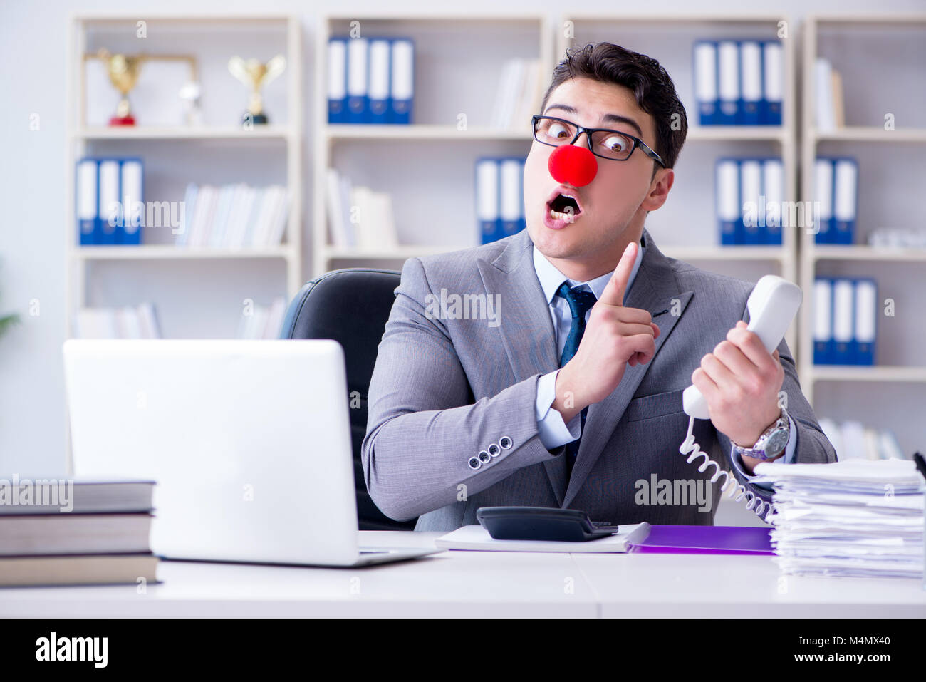 Clown businessman angry frustrated working in the office Stock Photo ...