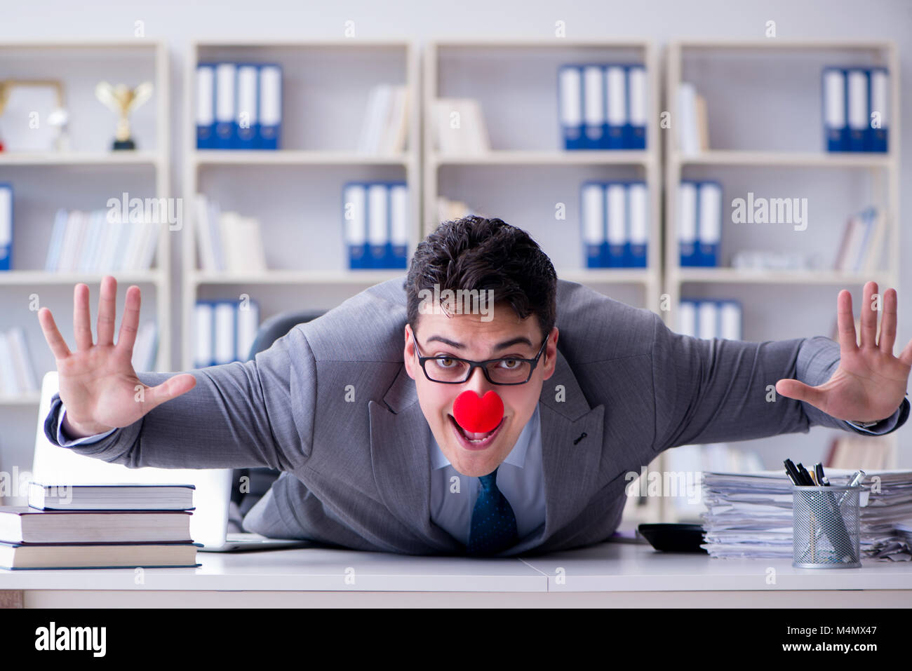Clown businessman working in the office Stock Photo - Alamy