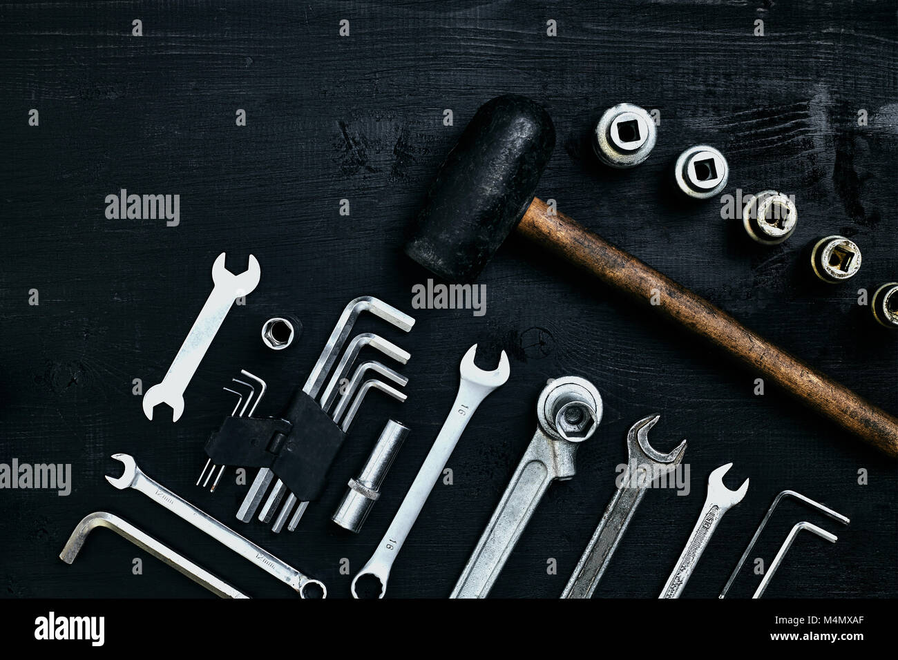 Flat lay of set of tools for car repairing such as wrenches on black ...