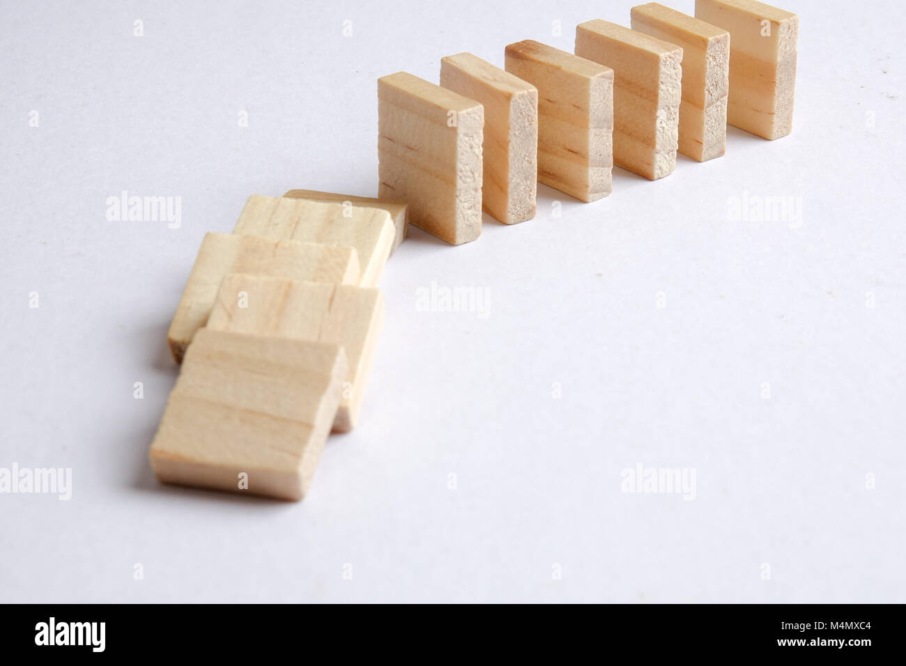 Domino effect isolated on white background Stock Photo - Alamy