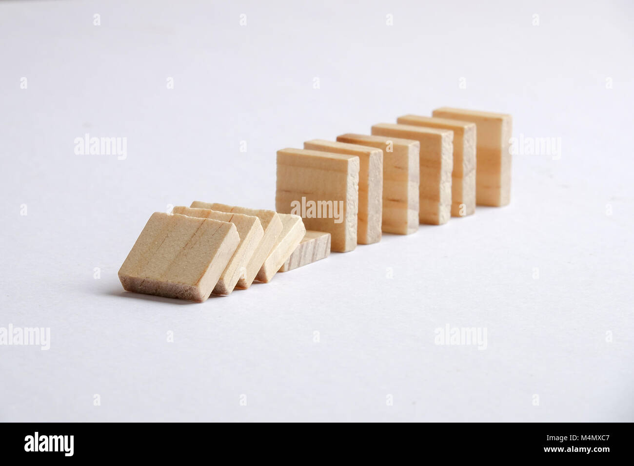 Domino effect isolated on white background Stock Photo - Alamy