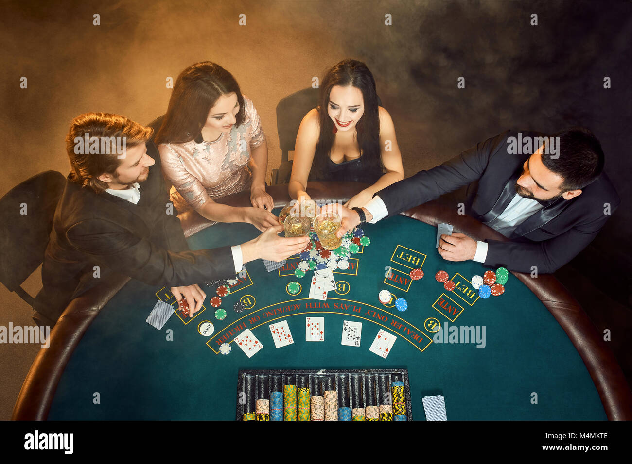 People sitting around poker table hi-res stock photography and images ...