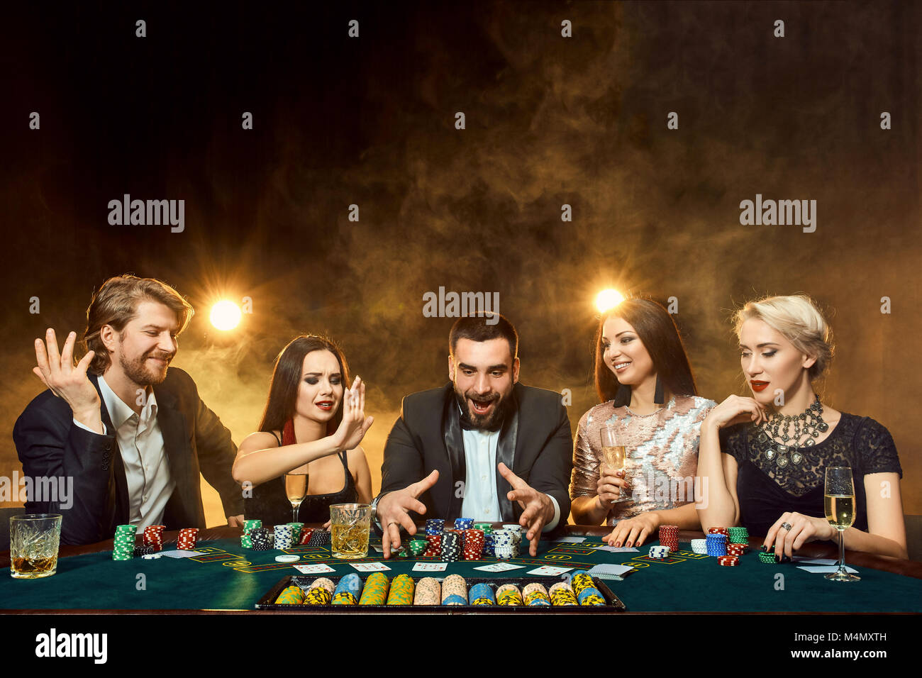 People around poker table hi-res stock photography and images - Alamy