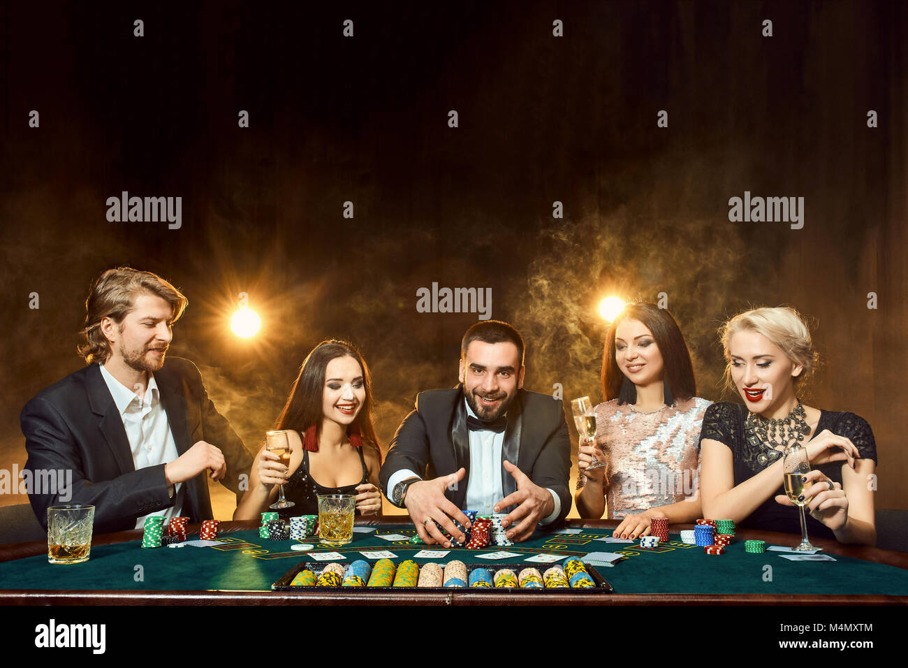 People sitting around poker table hi-res stock photography and images ...