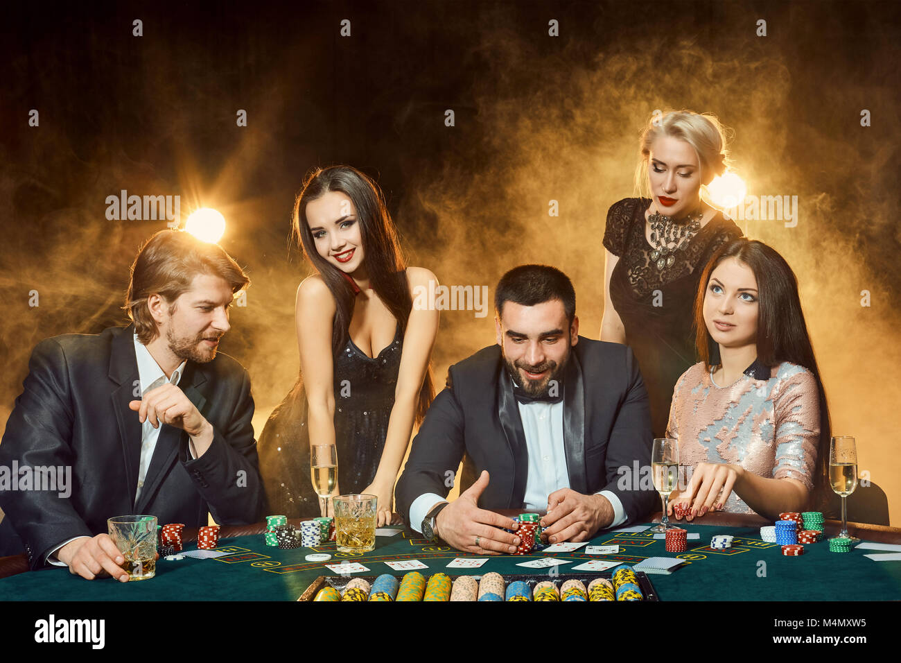 People sitting around poker table hi-res stock photography and images ...