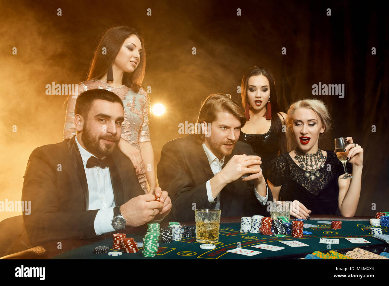 People sitting around poker table hi-res stock photography and images ...