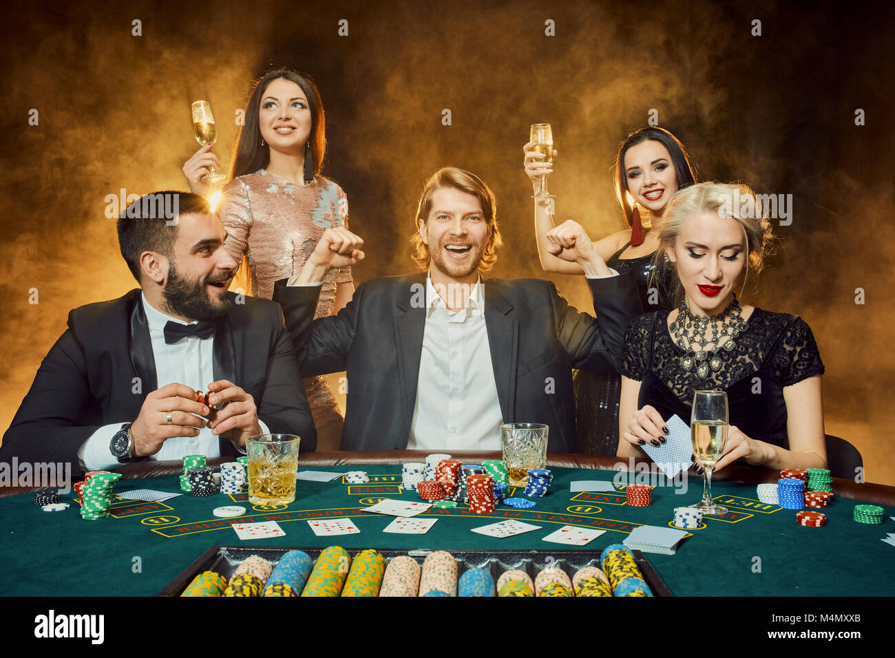 People sitting around poker table hi-res stock photography and images ...