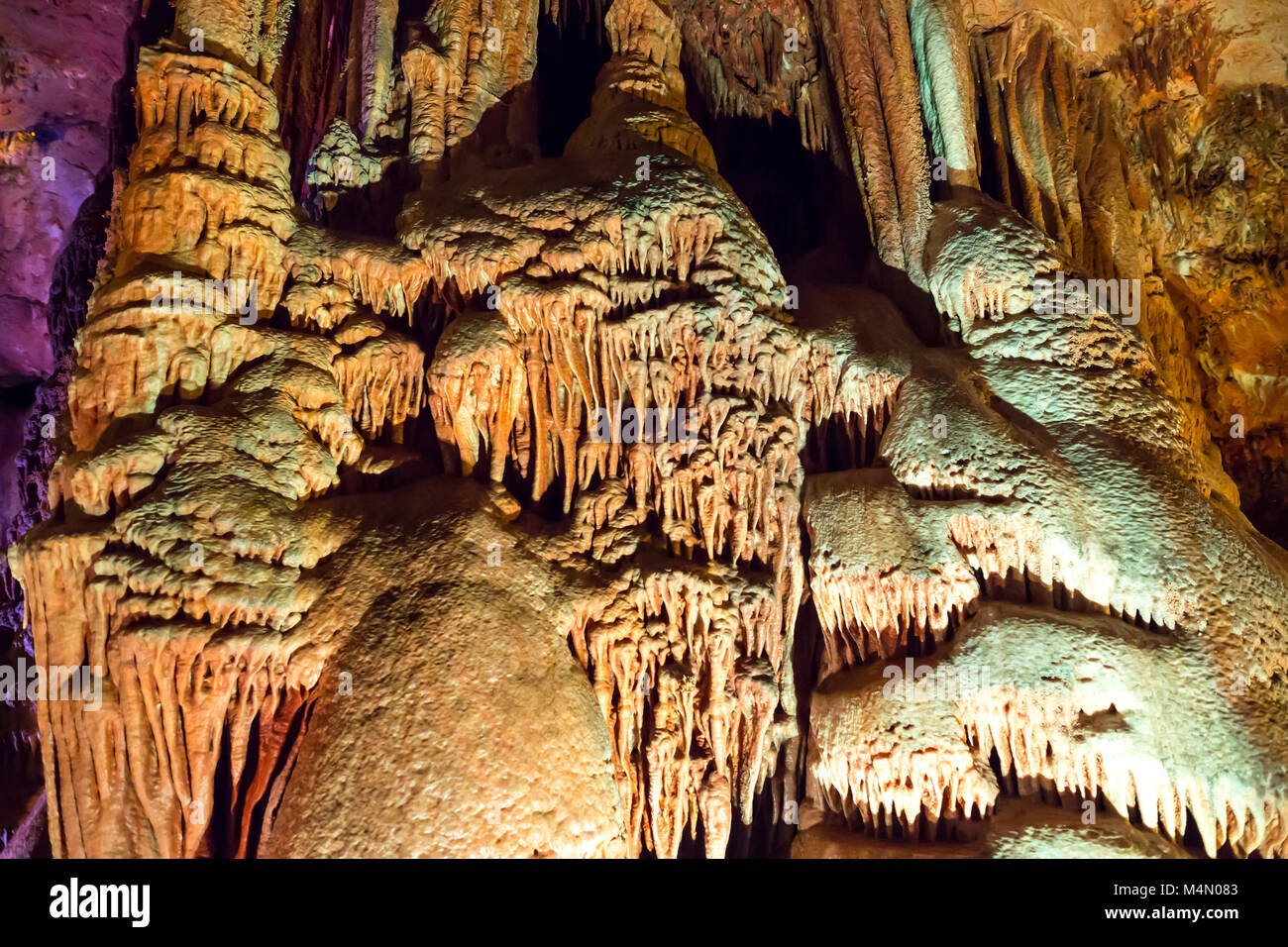 Venetsa Cave in Bulgaria. Beautiful colorful and illuminated cave full ...