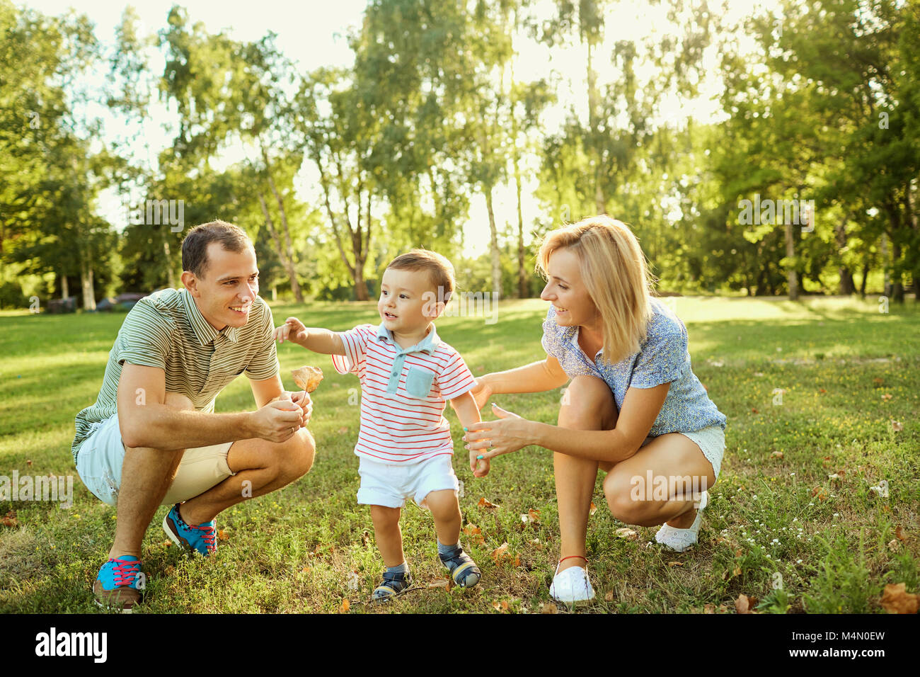 Happy family in nature Stock Photo - Alamy
