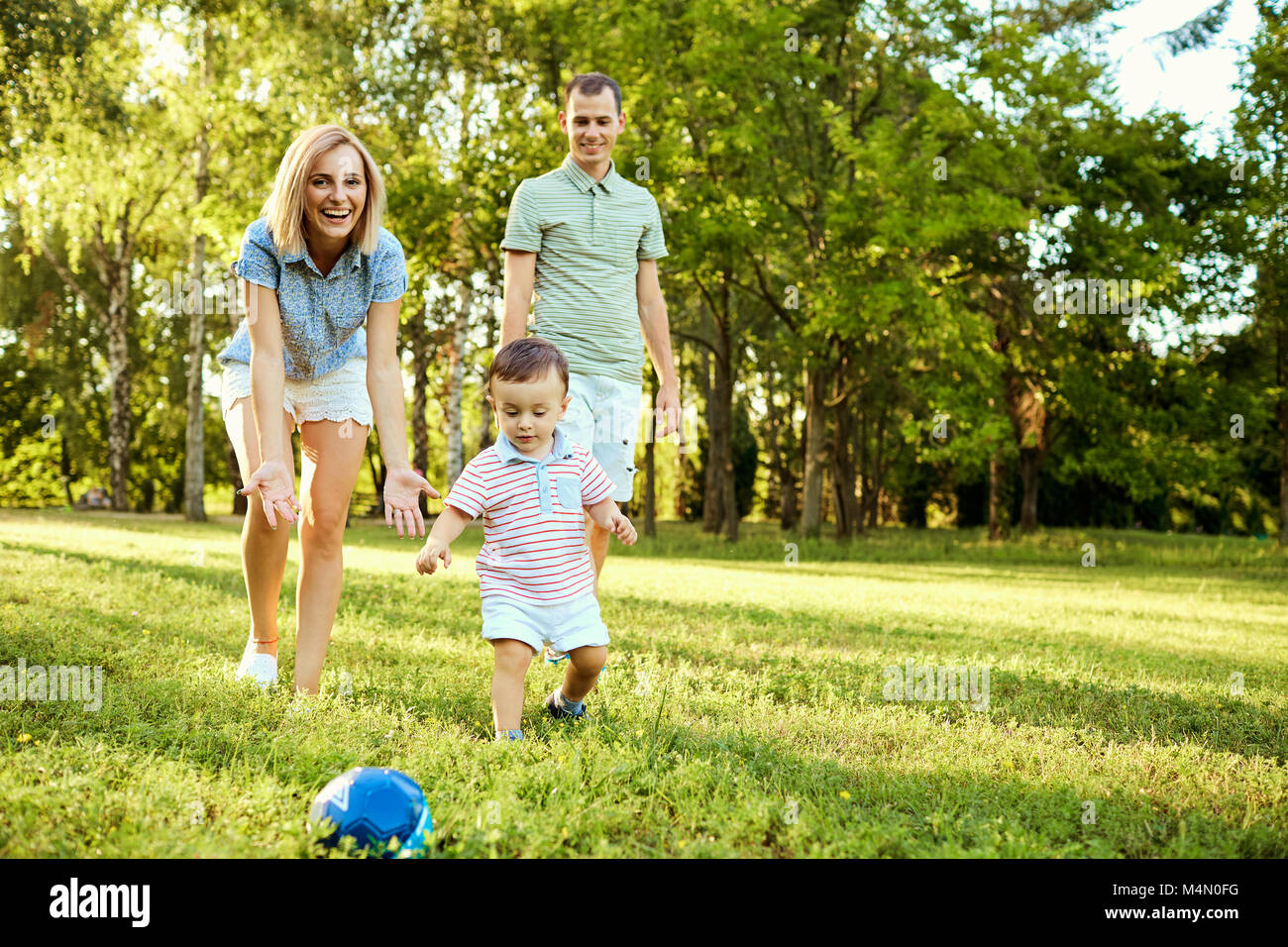 Happy family in nature Stock Photo - Alamy