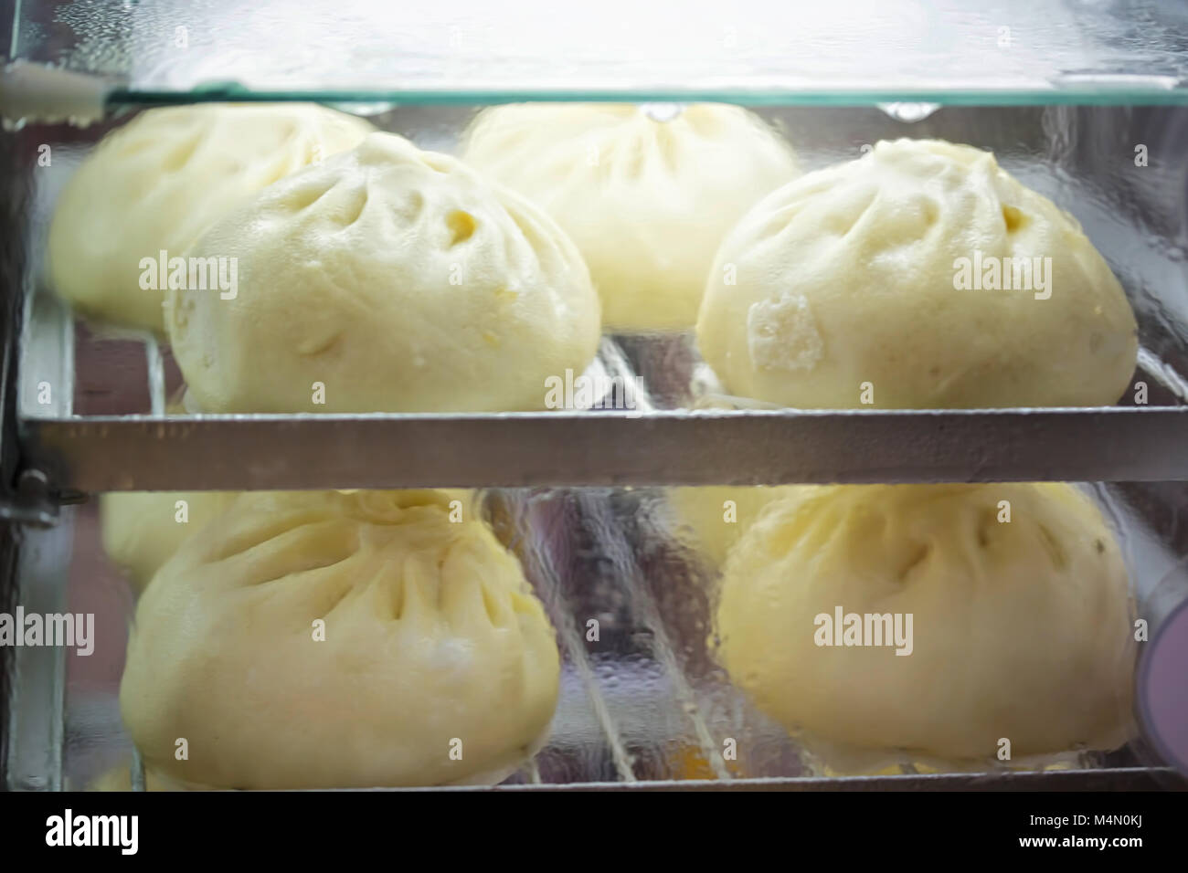 Chinese buns in steamer on display Stock Photo - Alamy