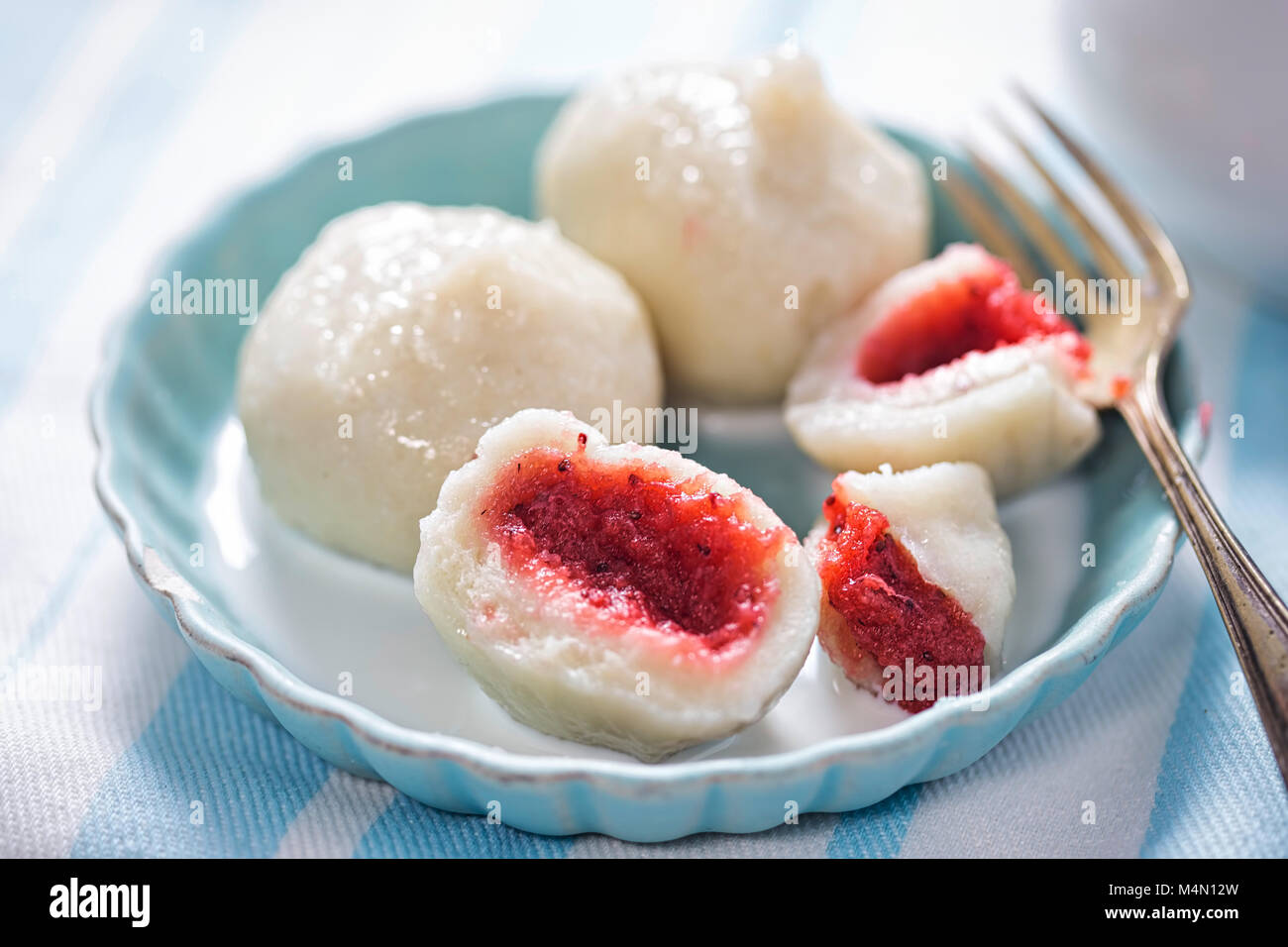Dumplings with strawberries and cream. Sweet pierogi with berry fruit ...