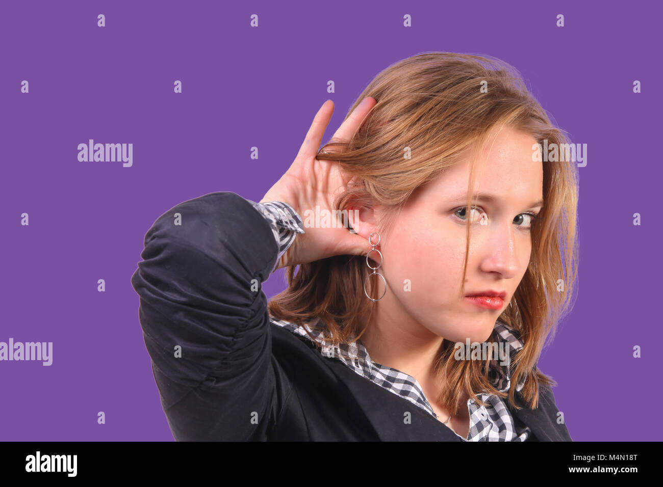 Close up of a pretty young woman listening Stock Photo - Alamy