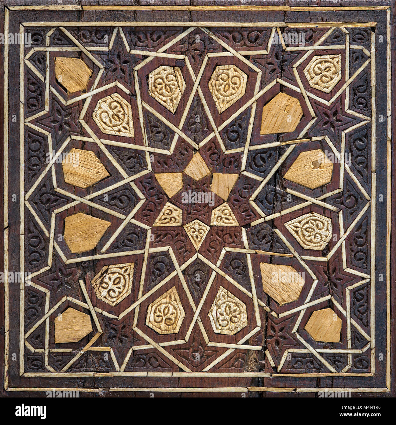 Closeup of arabesque seamless geometric pattern on an ancient wooden ...