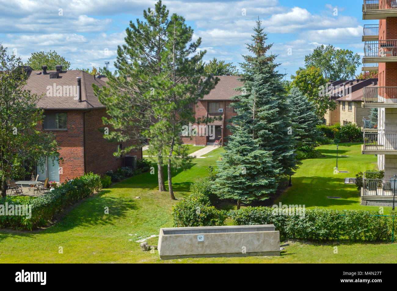 Modern condo buildings and houses with huge windows and balconies in ...