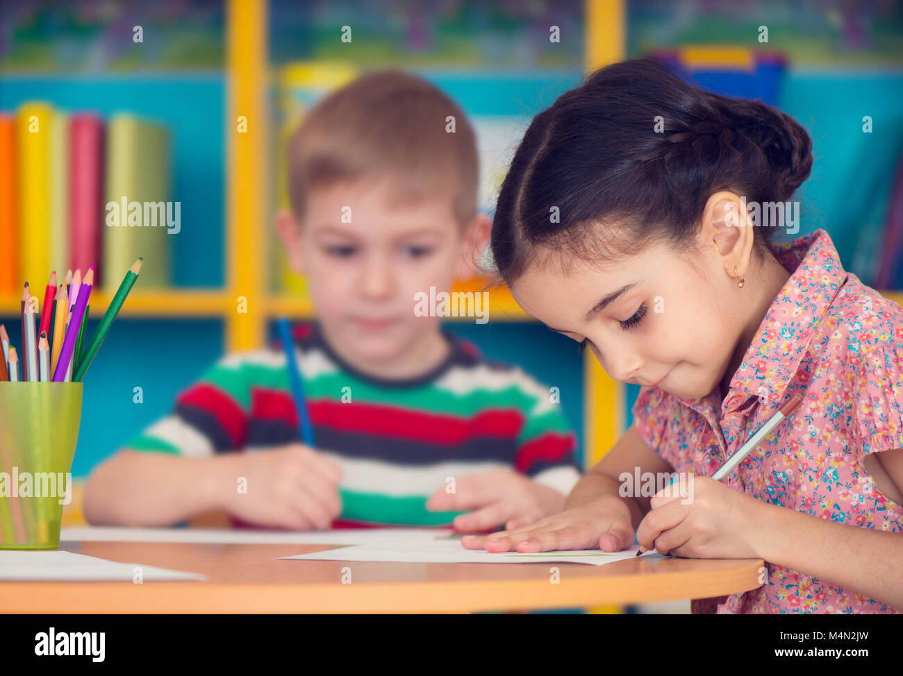 Beautiful little girl and her classmate at school Stock Photo - Alamy