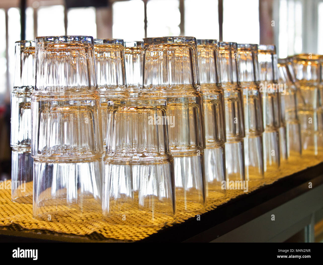 Stacks of clean glasses in the restaurant Stock Photo - Alamy
