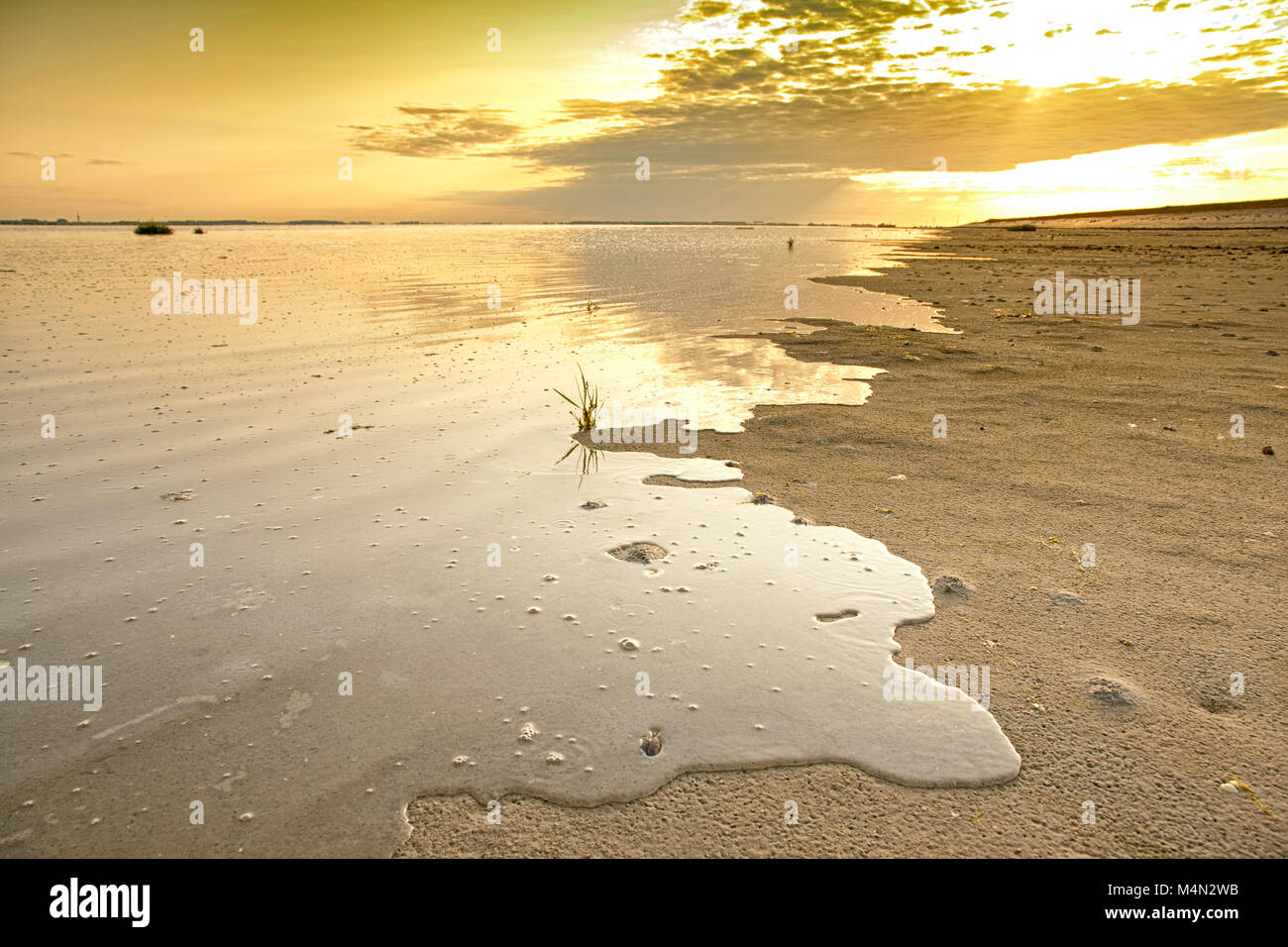 The upcoming tide floods parts of the beach of the island Tholen in ...