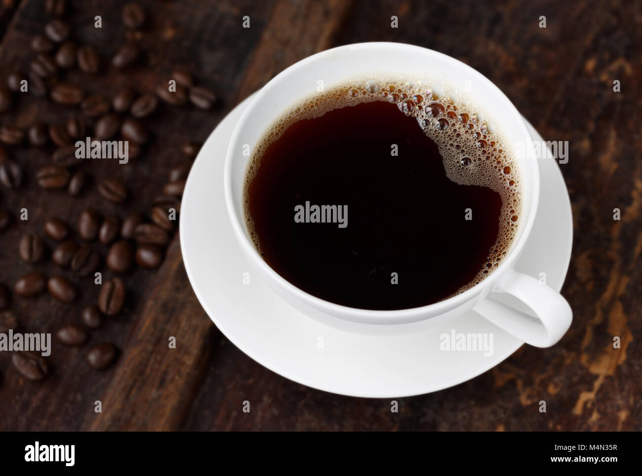 Coffee beans poured cup hi-res stock photography and images - Alamy