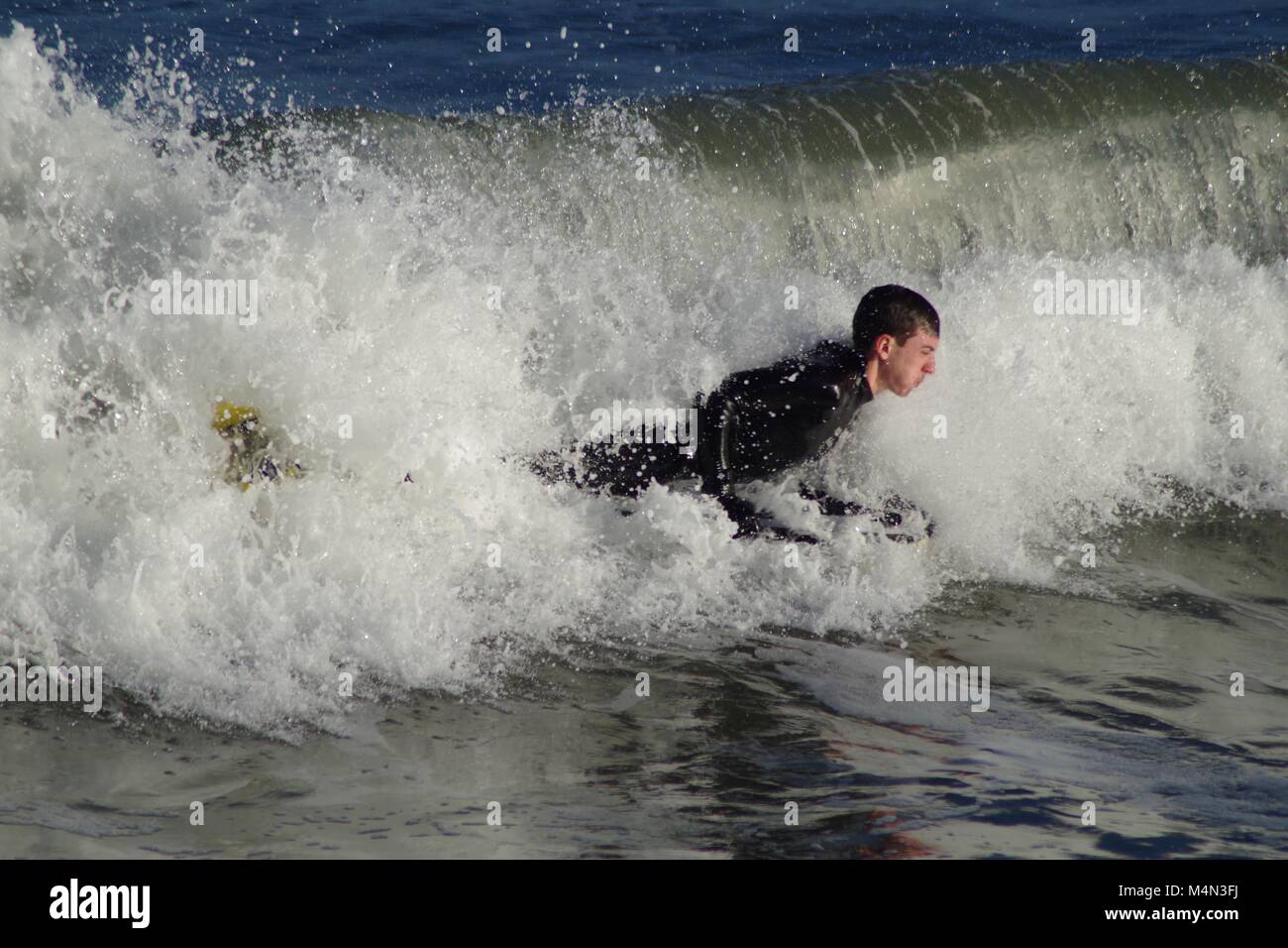 Daring Male Bodyboarder Surfing the Cold North Sea Waves at Aberdeen ...