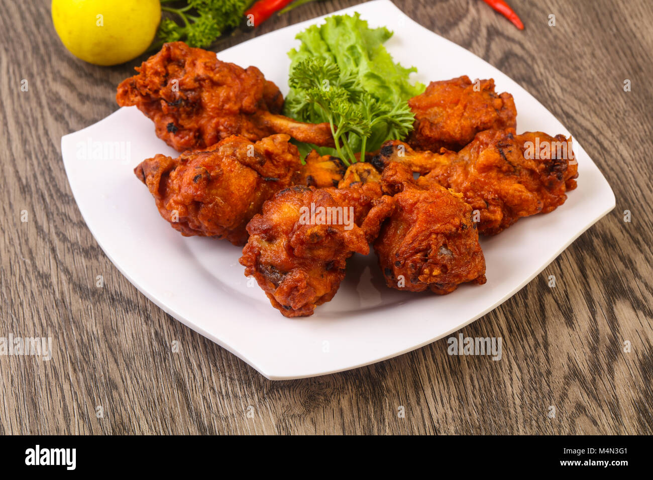 Indian traditional cuisine - Chicken lollipops with spices Stock Photo ...
