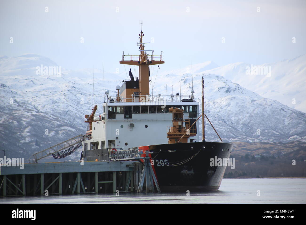 The crew aboard the Coast Guard Cutter SPAR waits in port at Base ...