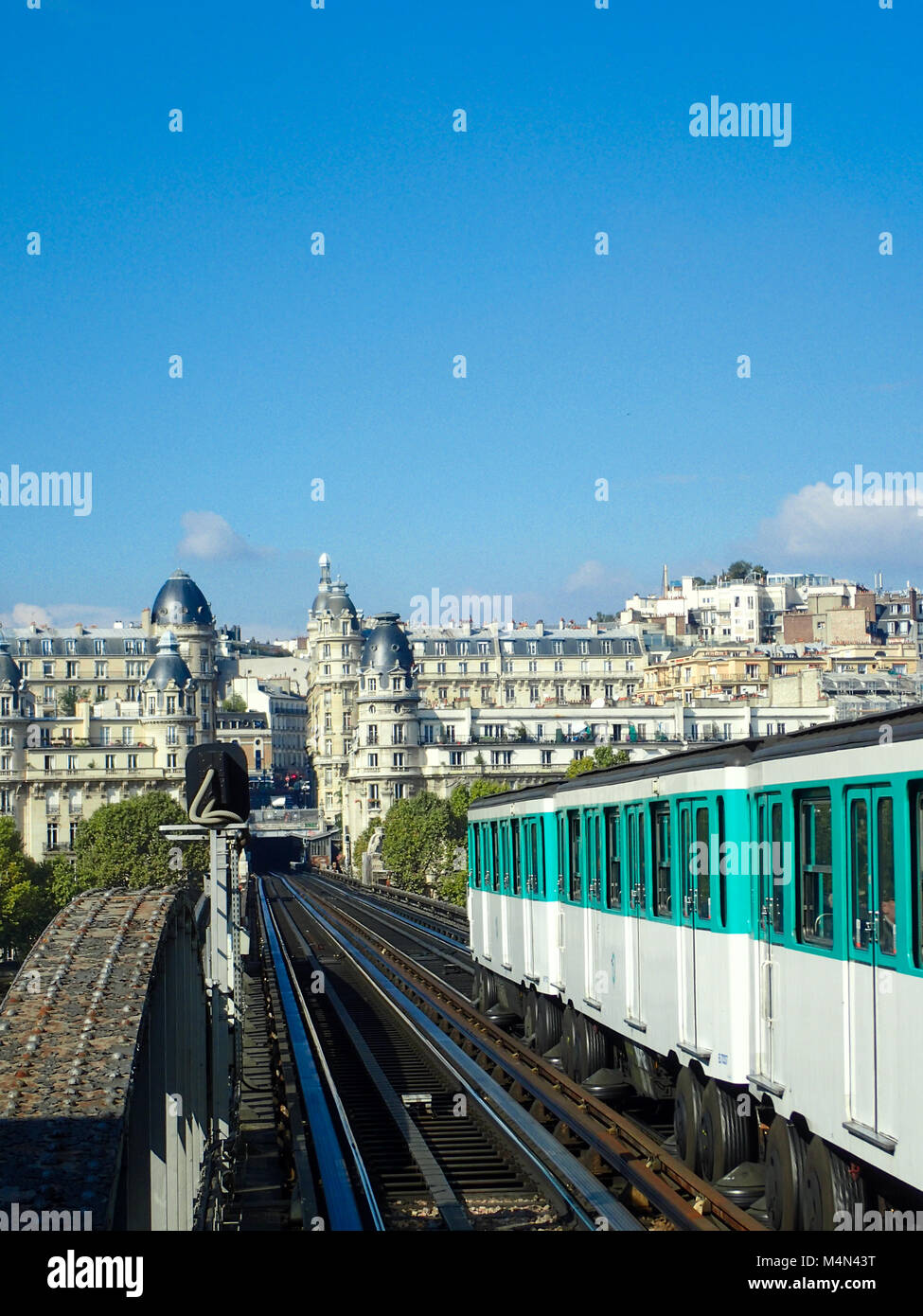 A train crossing a bridge in Paris, France Stock Photo - Alamy