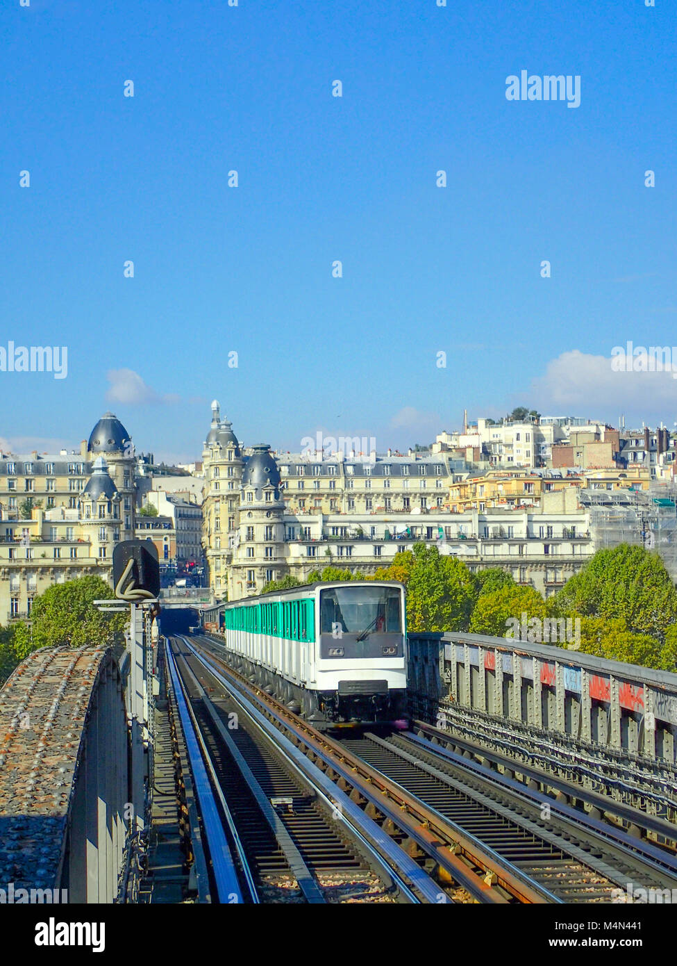 A train crossing a bridge in Paris, France Stock Photo - Alamy