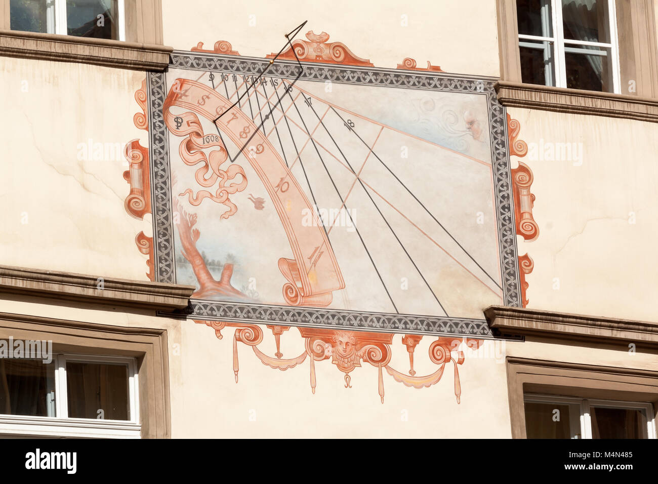 The detail of sundial from 17 century painted on facade of renaissance ...