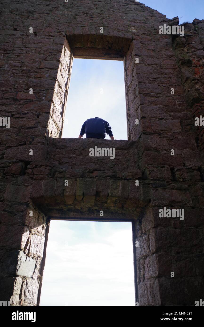 Student "Rooftopping" Climbing an Empty Window Frame of the Ruinous New ...