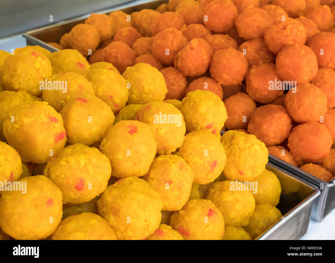 Yellow ladoo hi-res stock photography and images - Alamy