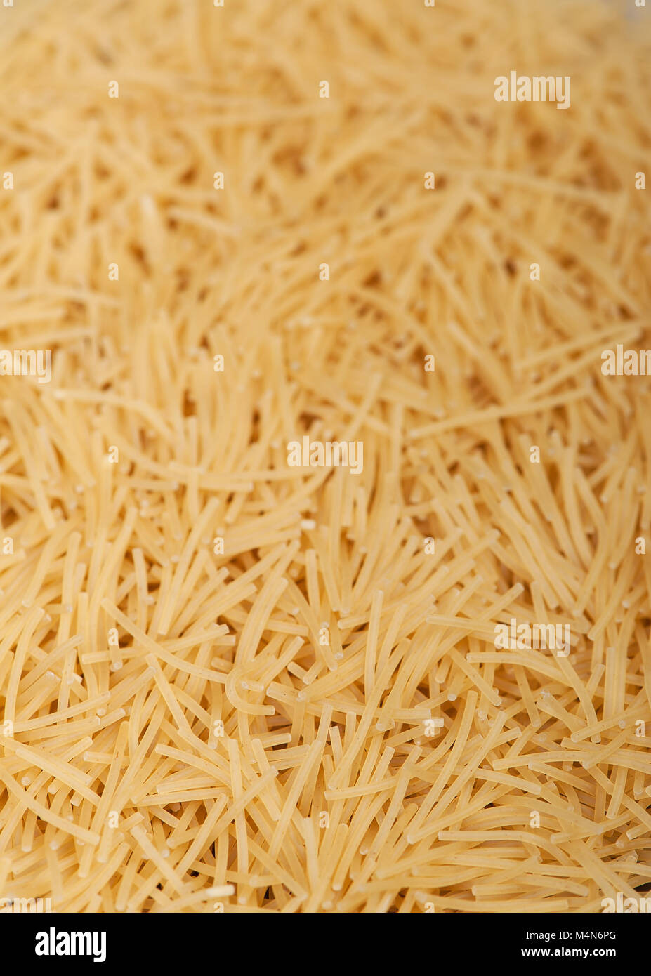 Raw vermicelli pasta texture background Stock Photo - Alamy