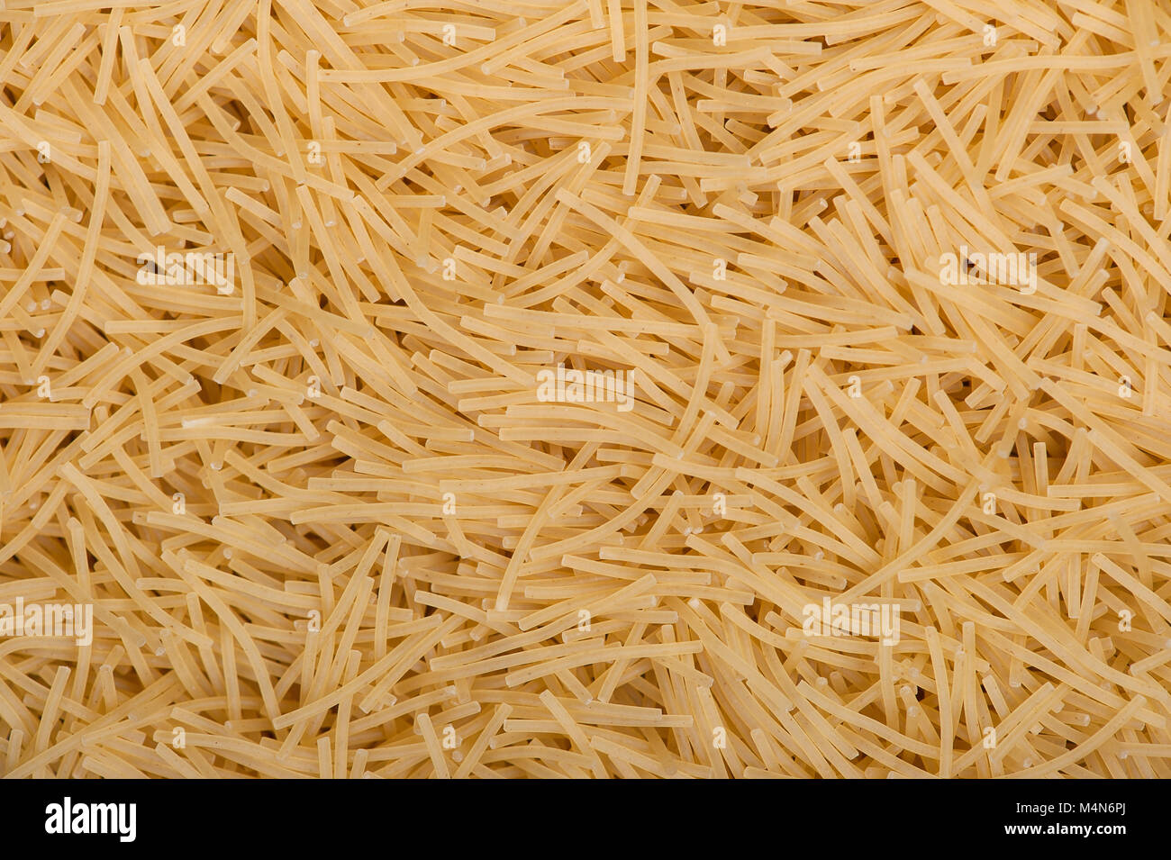 Raw vermicelli pasta texture background Stock Photo - Alamy