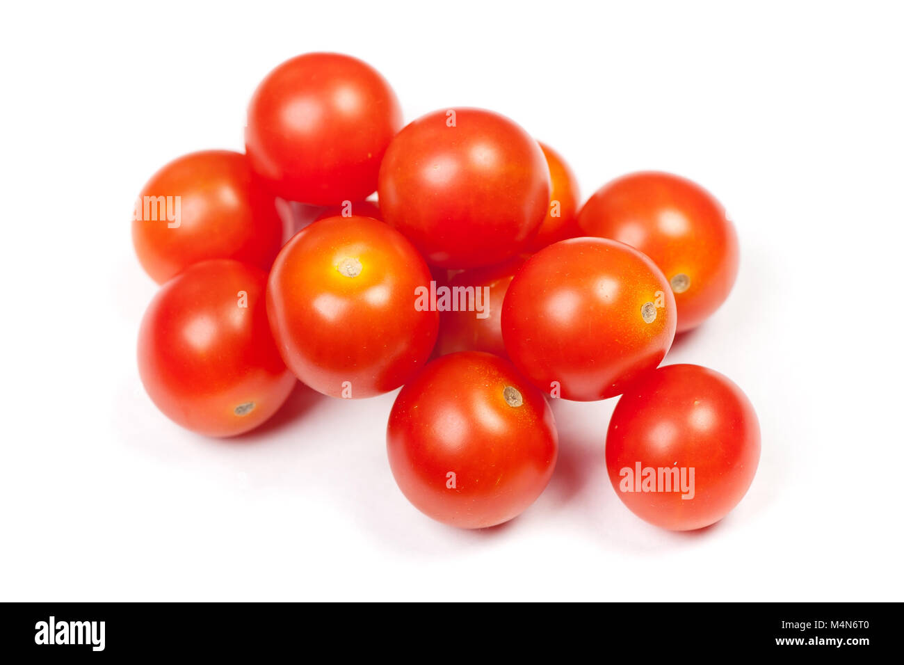 Heap of cherry tomatoes isolated on white background Stock Photo - Alamy