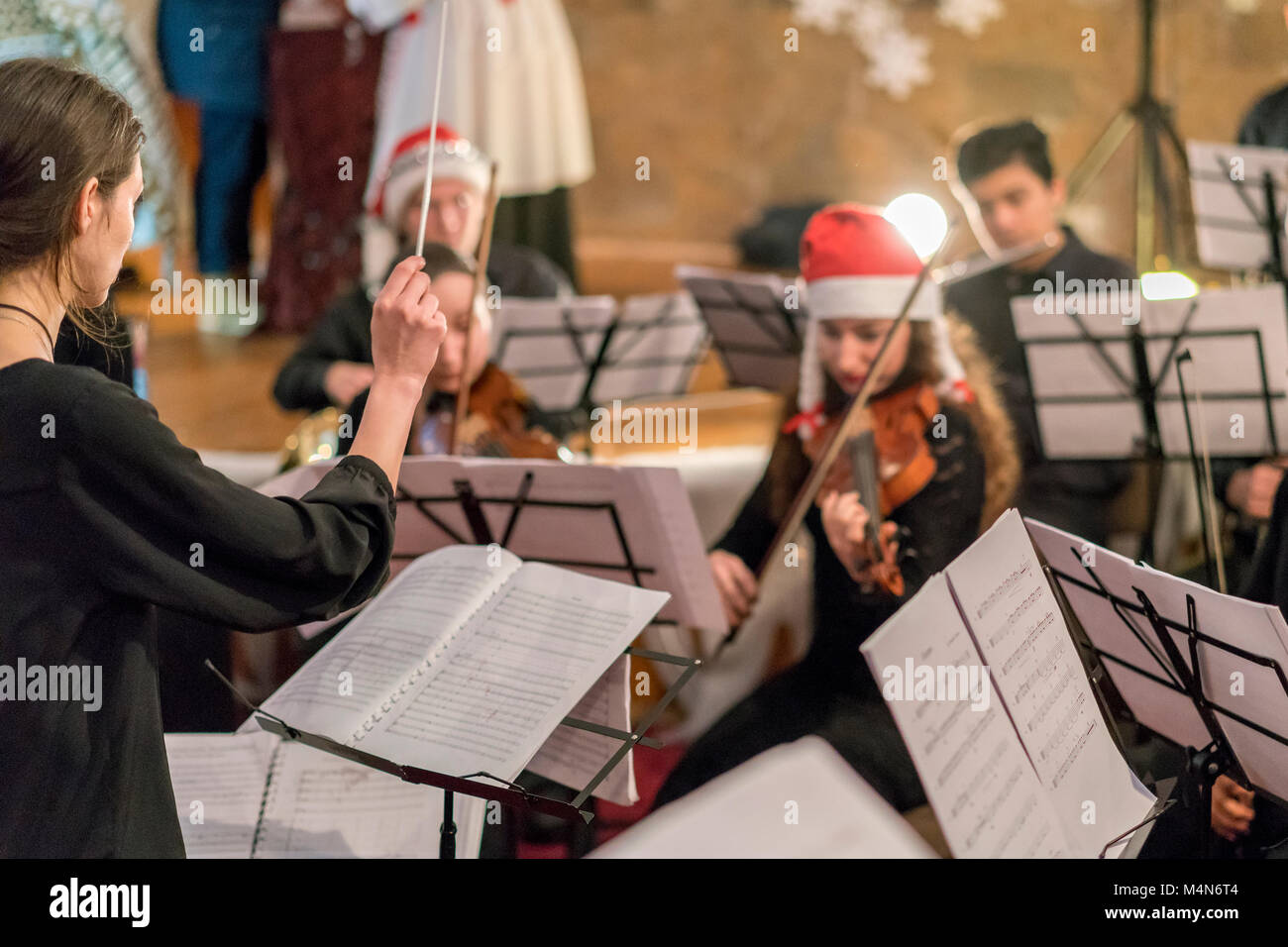 girl conductor in front of the orchestra Stock Photo - Alamy