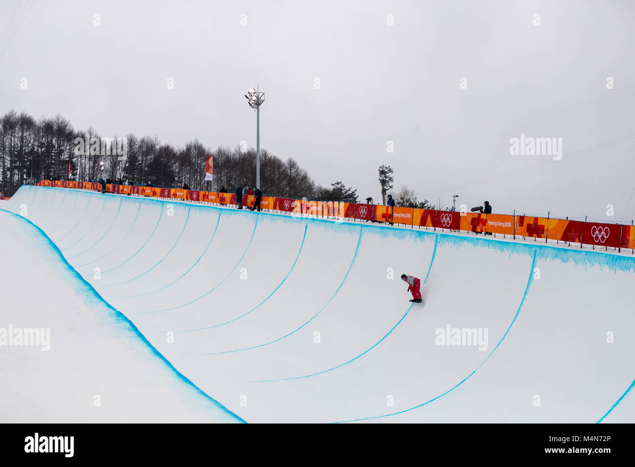 Snowboarder competing in the Men's Snowboarding Half Pipe at the ...